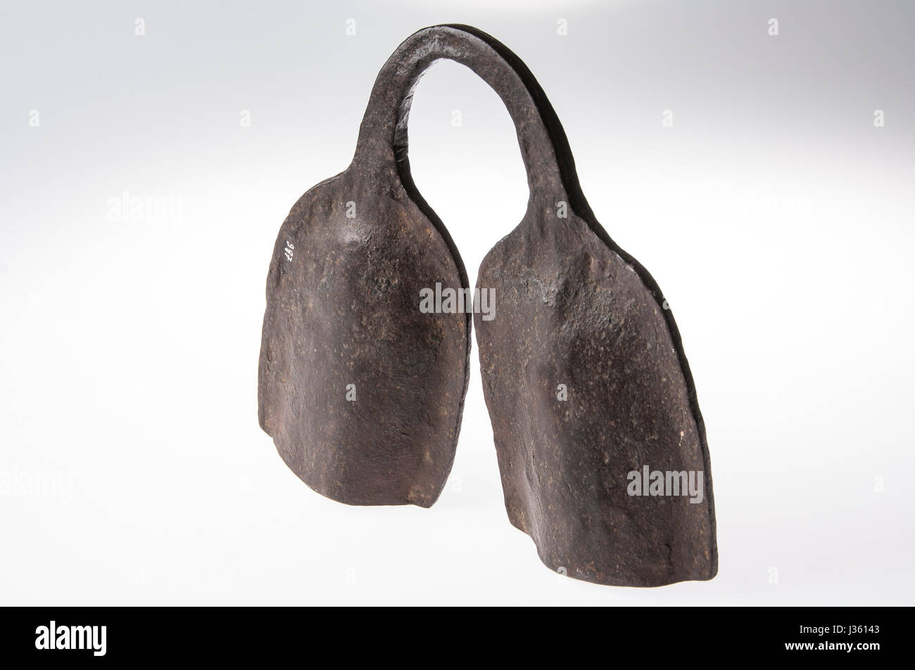 African instrument made by hand, brass, kind of bell, isolated on white ...