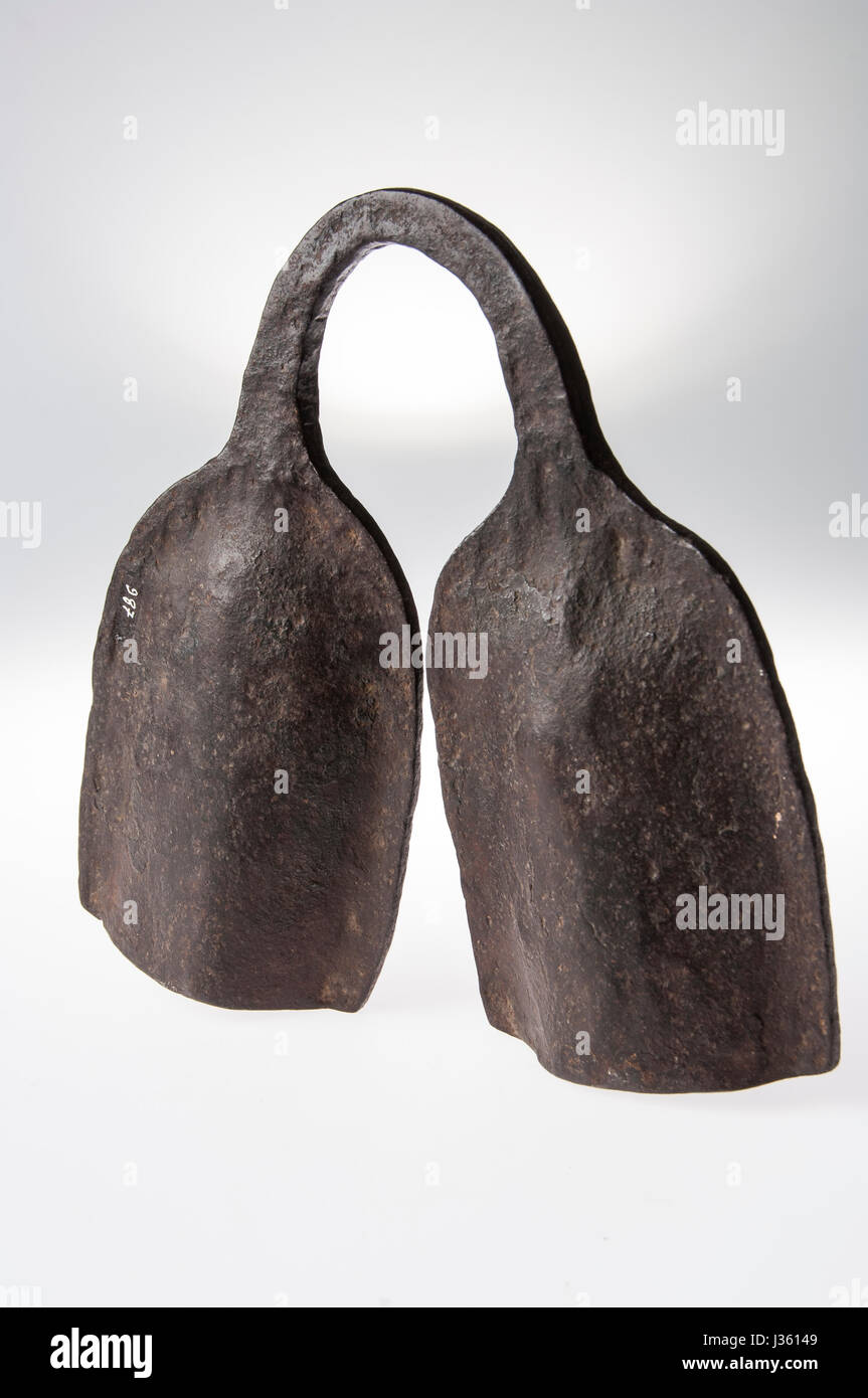 African instrument made by hand, brass, kind of bell, isolated on white ...