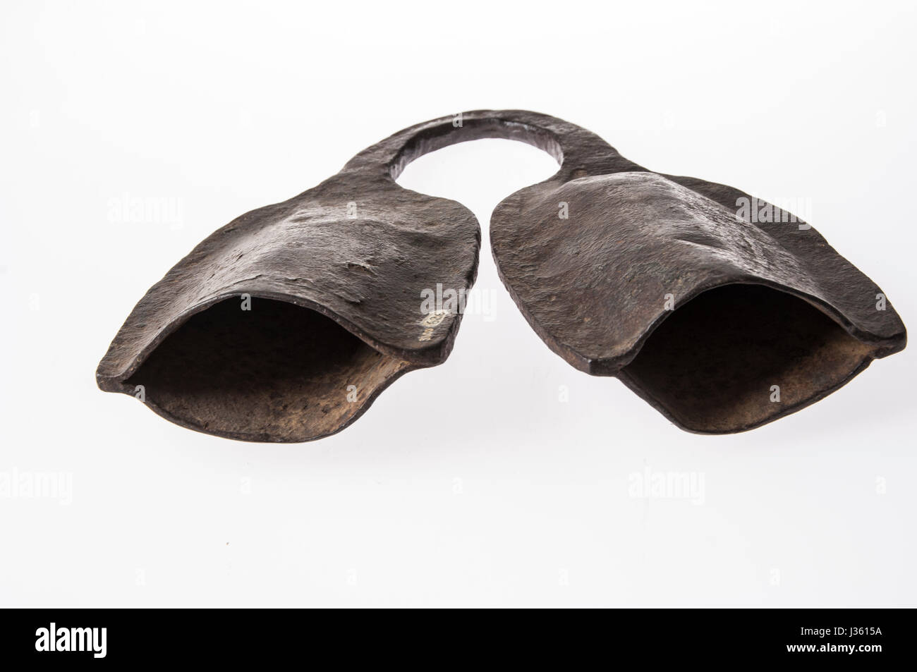 African instrument made by hand, brass, kind of bell, isolated on white ...