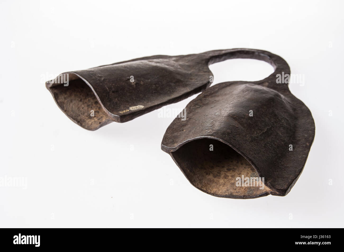 African instrument made by hand, brass, kind of bell, isolated on white ...