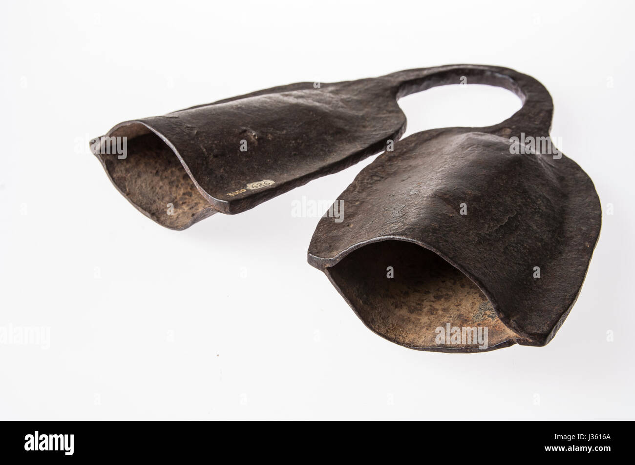 African instrument made by hand, brass, kind of bell, isolated on white ...
