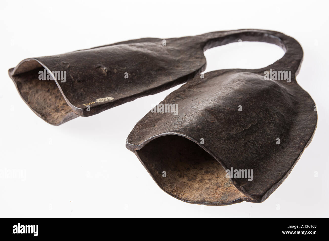 African instrument made by hand, brass, kind of bell, isolated on white ...