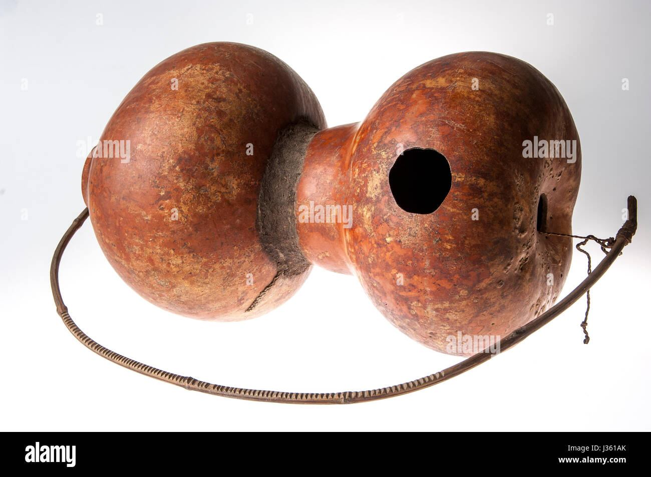 African handmade instrument, blowing, isolated on white background ...