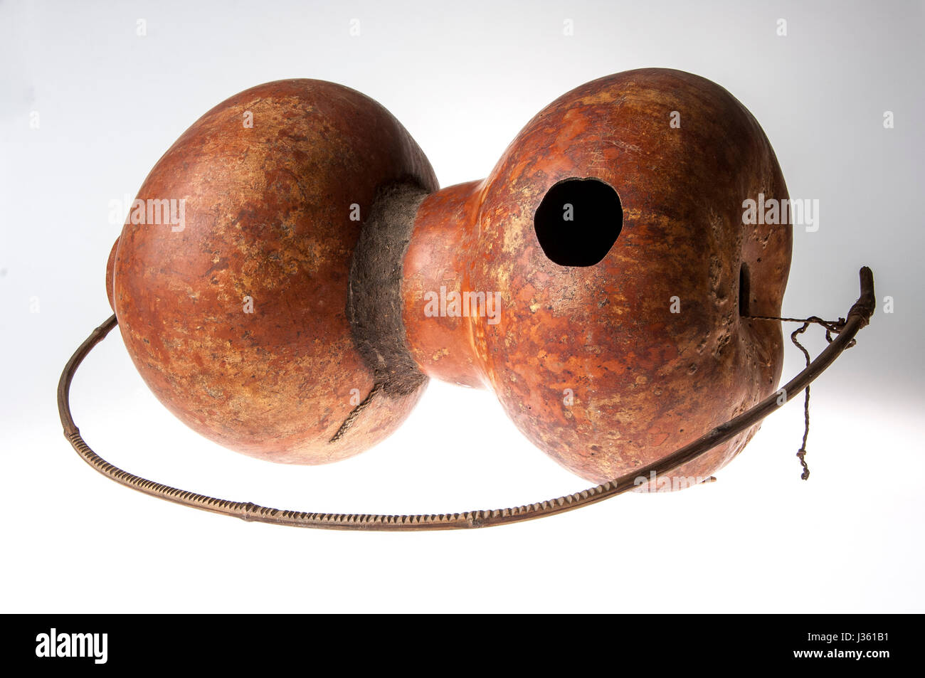 African handmade instrument, blowing, isolated on white background ...