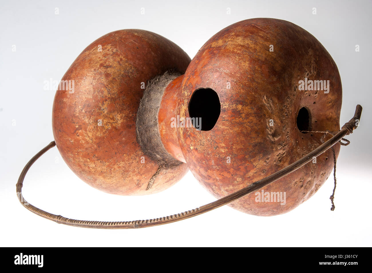 African handmade instrument, blowing, isolated on white background ...