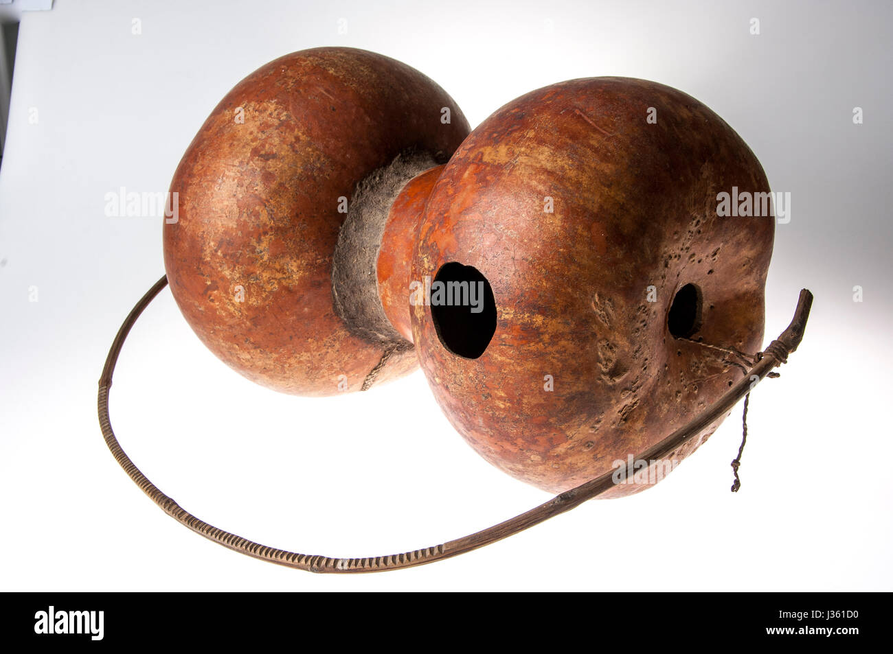 African handmade instrument, blowing, isolated on white background ...