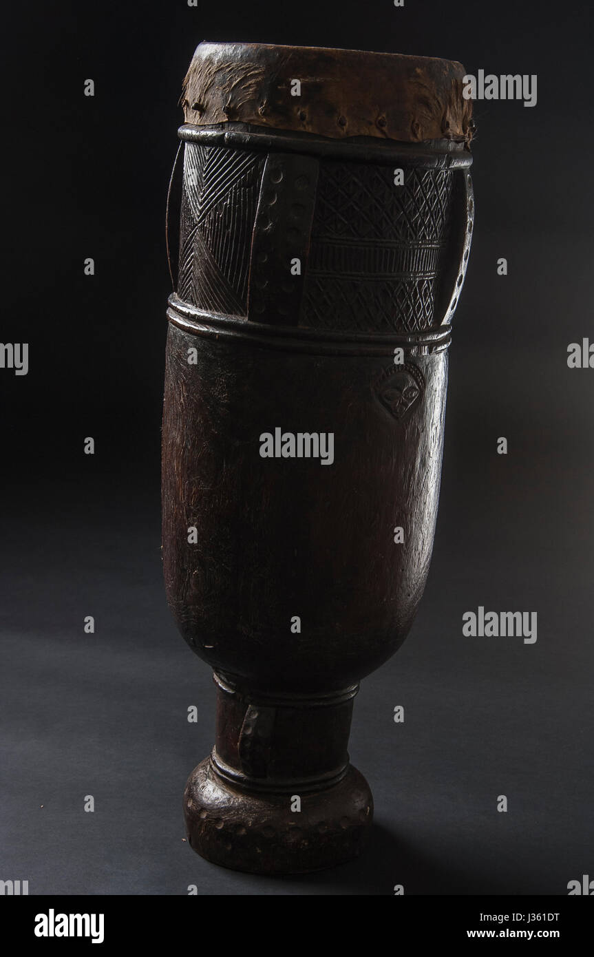Handmade african instrument, wooden drum, isolated on black background ...