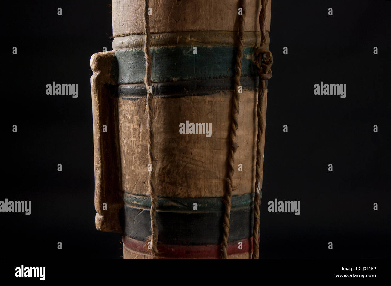 Handmade african instrument, wooden drum, isolated on black background ...