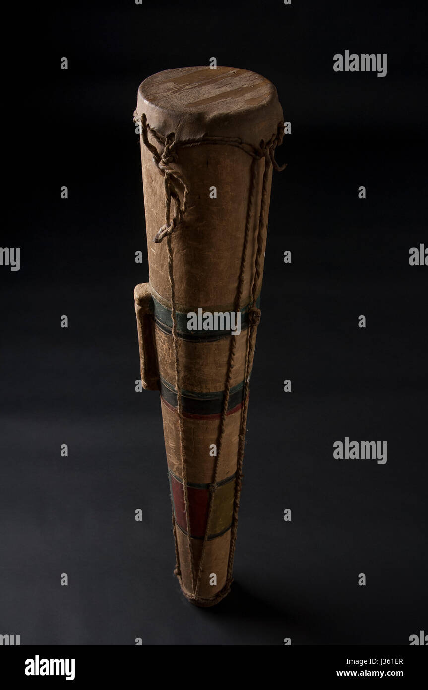 Handmade african instrument, wooden drum, isolated on black background ...
