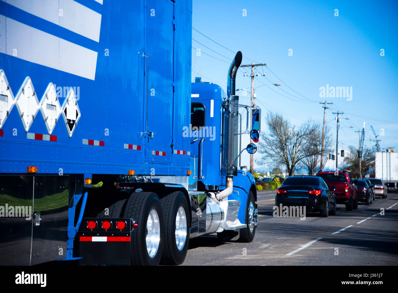 Spectacular bright blue big rig semi truck with a blue trailer with ...
