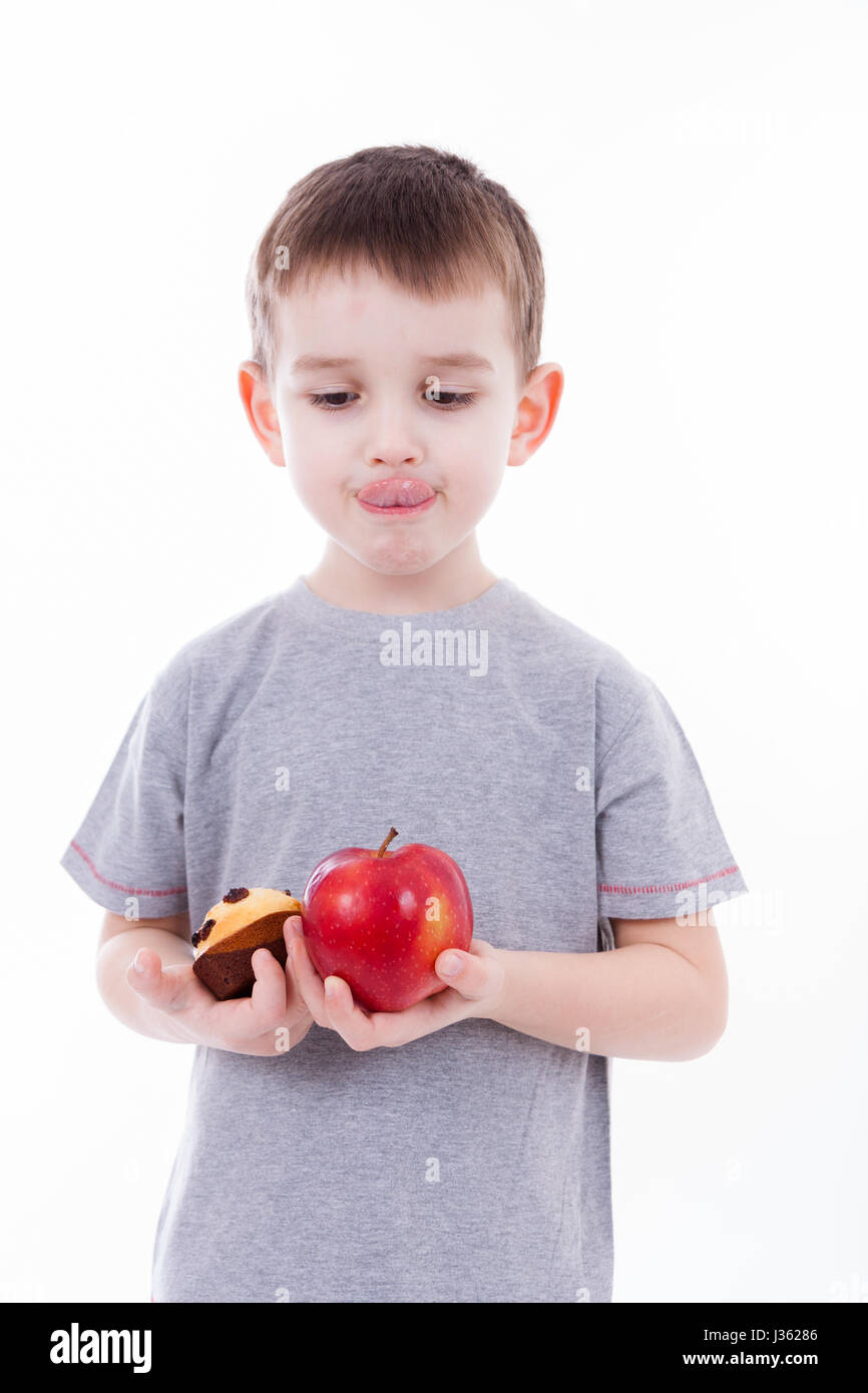 little boy with food isolated on white background - apple or a muffin ...