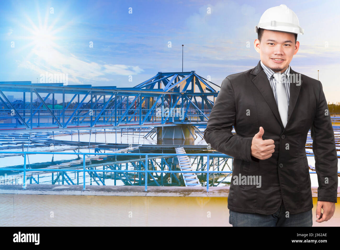 environmental engineering man standing in front of waterworks in heavy ...
