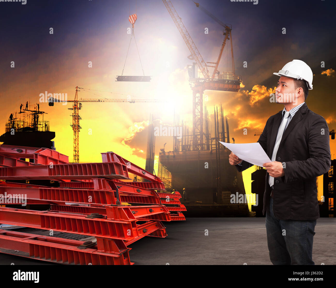 engineering man working in building construction site and reading plan ...