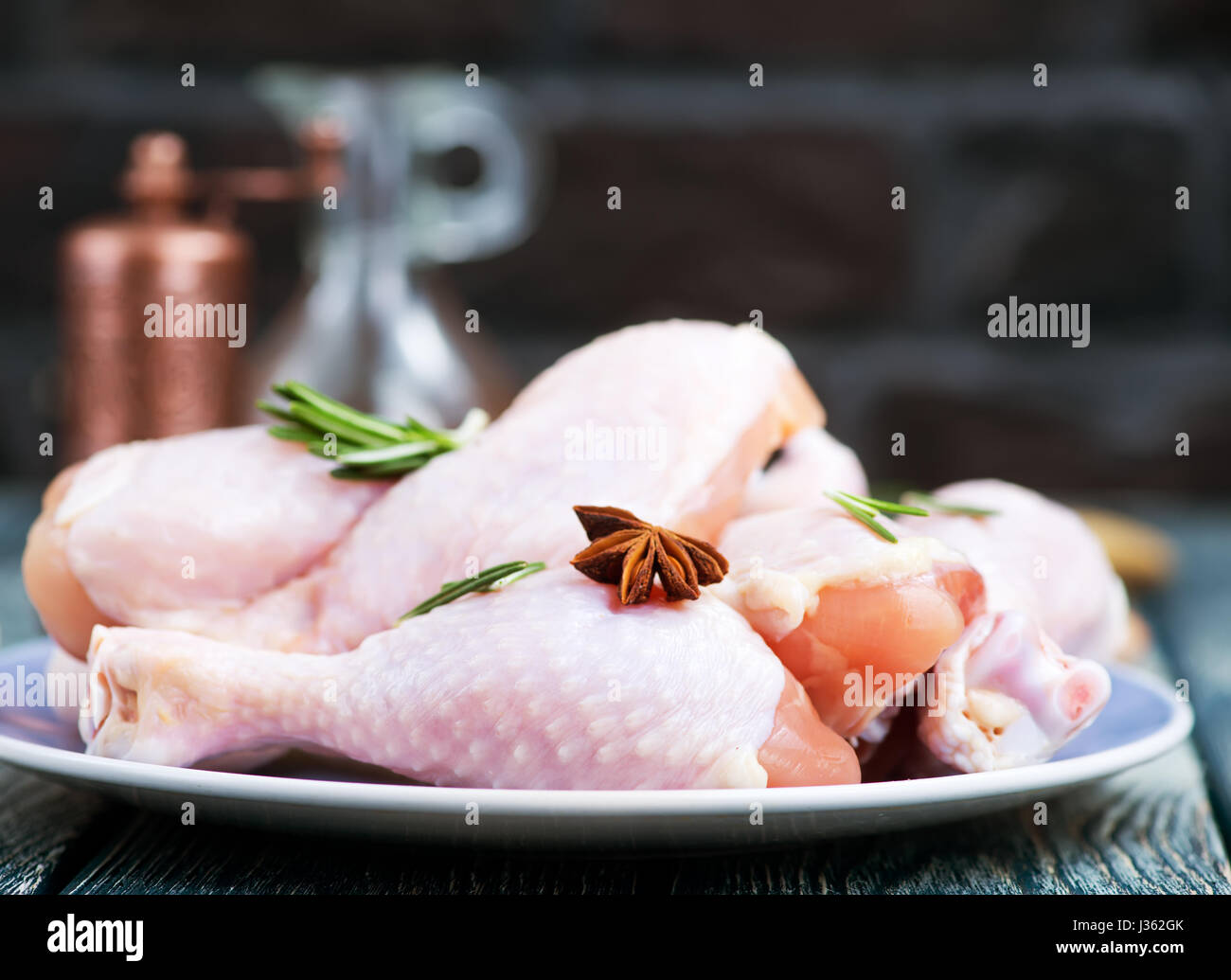 raw chicken legs on the metal plate Stock Photo - Alamy