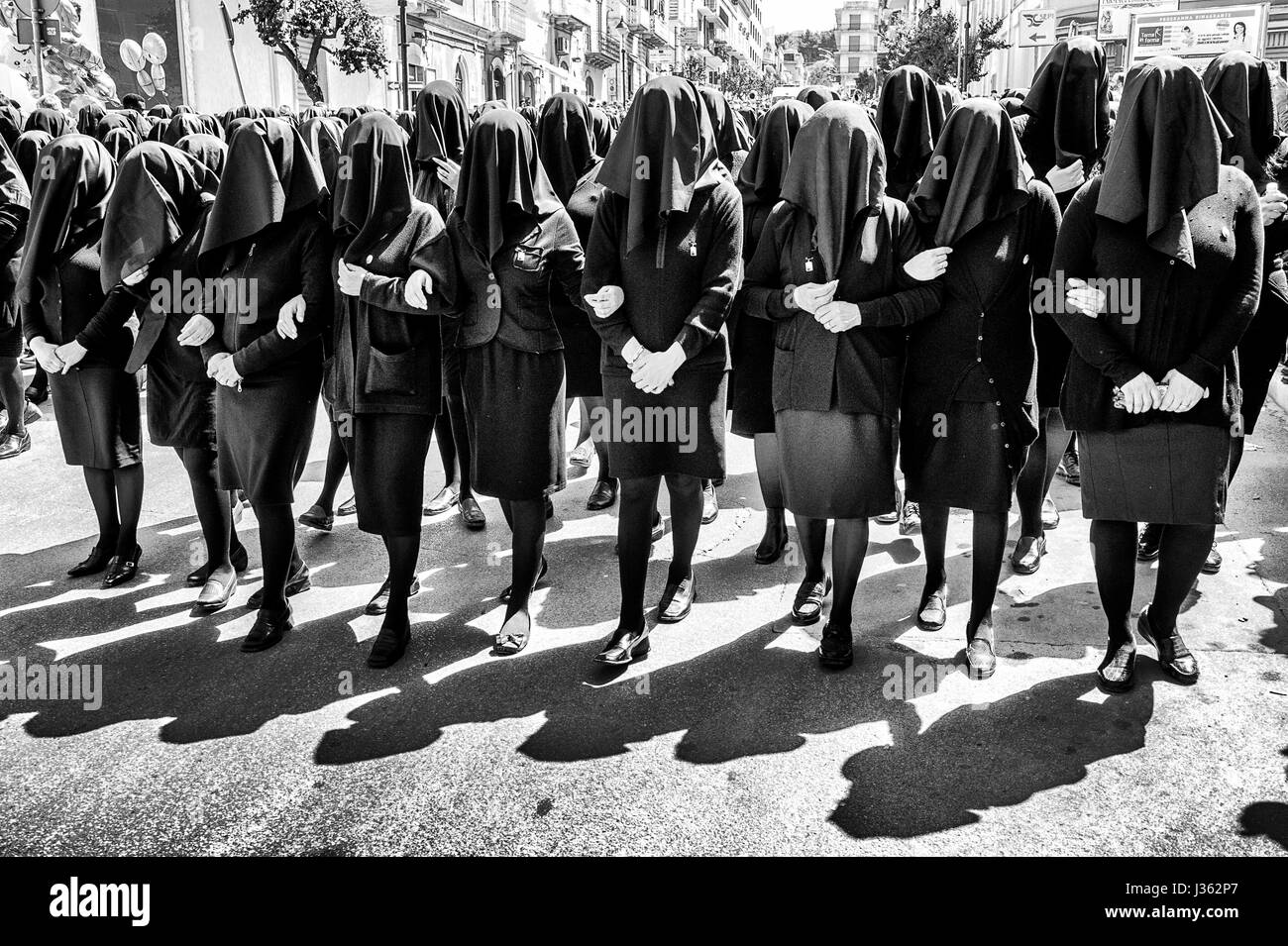 The women dressed in black parading along the streets of Canosa di ...