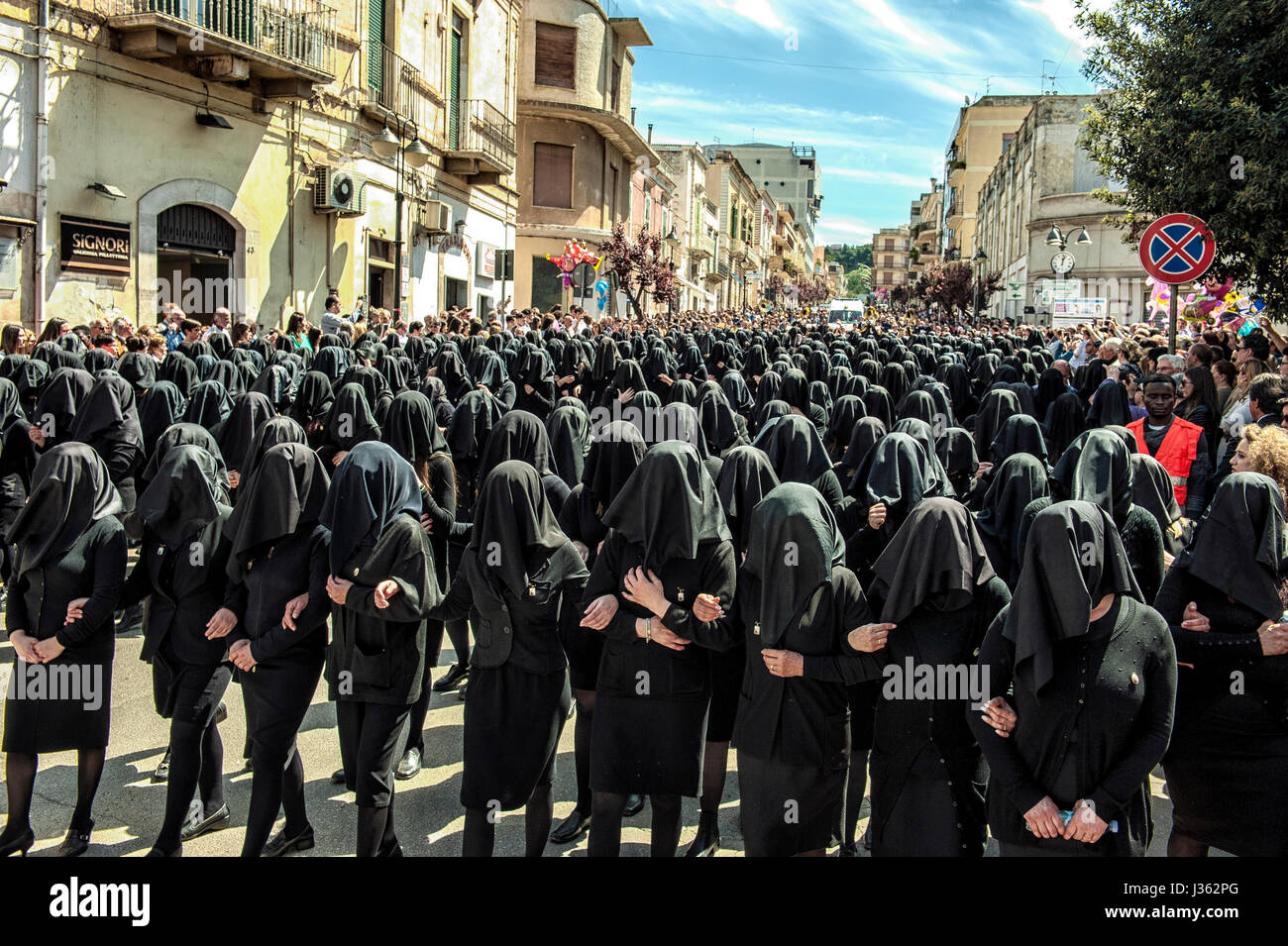 The women dressed in black parading along the streets of Canosa di ...