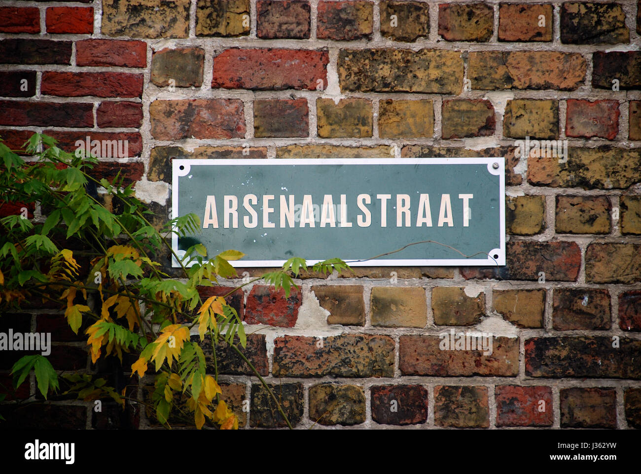 Street sign - Arsenaalstraat in the city of Bruges, Belgium Stock Photo ...