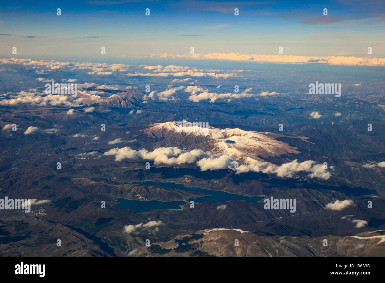 landscape from plane window of high mountain in italy after plane ...
