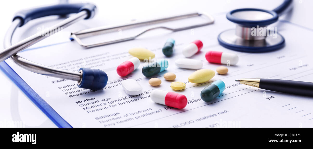 Medicine on medical form with stethoscope and pen Stock Photo - Alamy