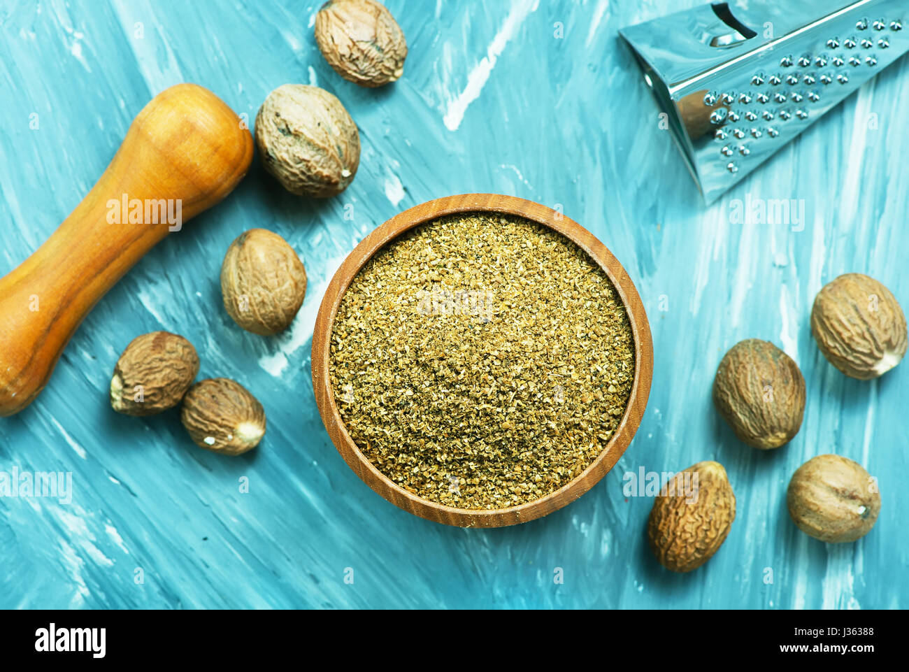 nutmeg and powder in bowl and on a table Stock Photo - Alamy
