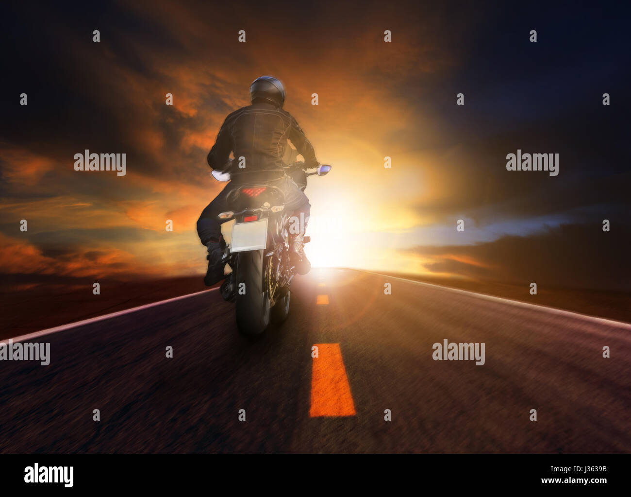 man riding big motorcycle on asphalt road Stock Photo - Alamy