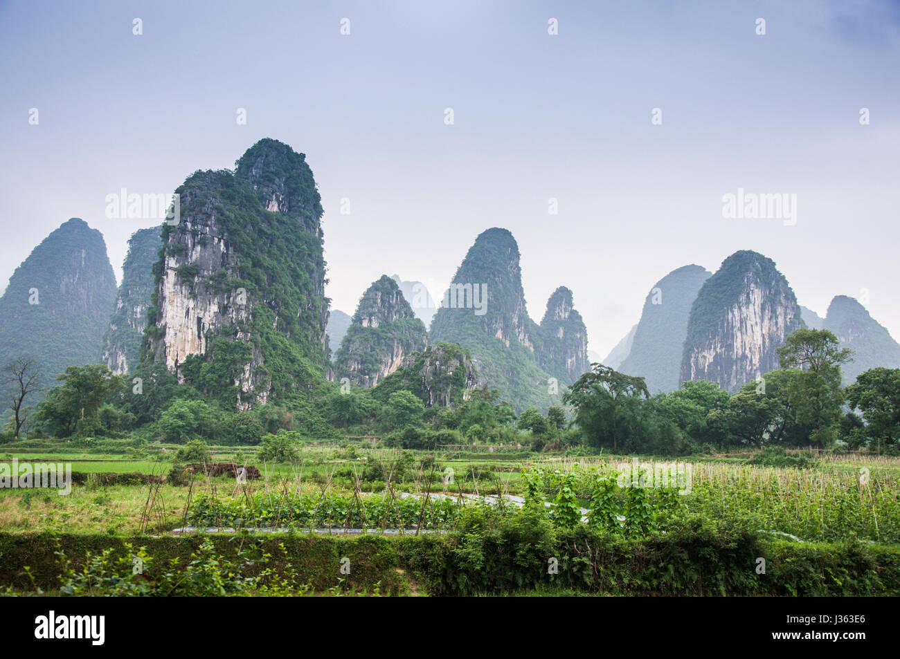Beautiful karst mountains and rural scenery in summer Stock Photo - Alamy