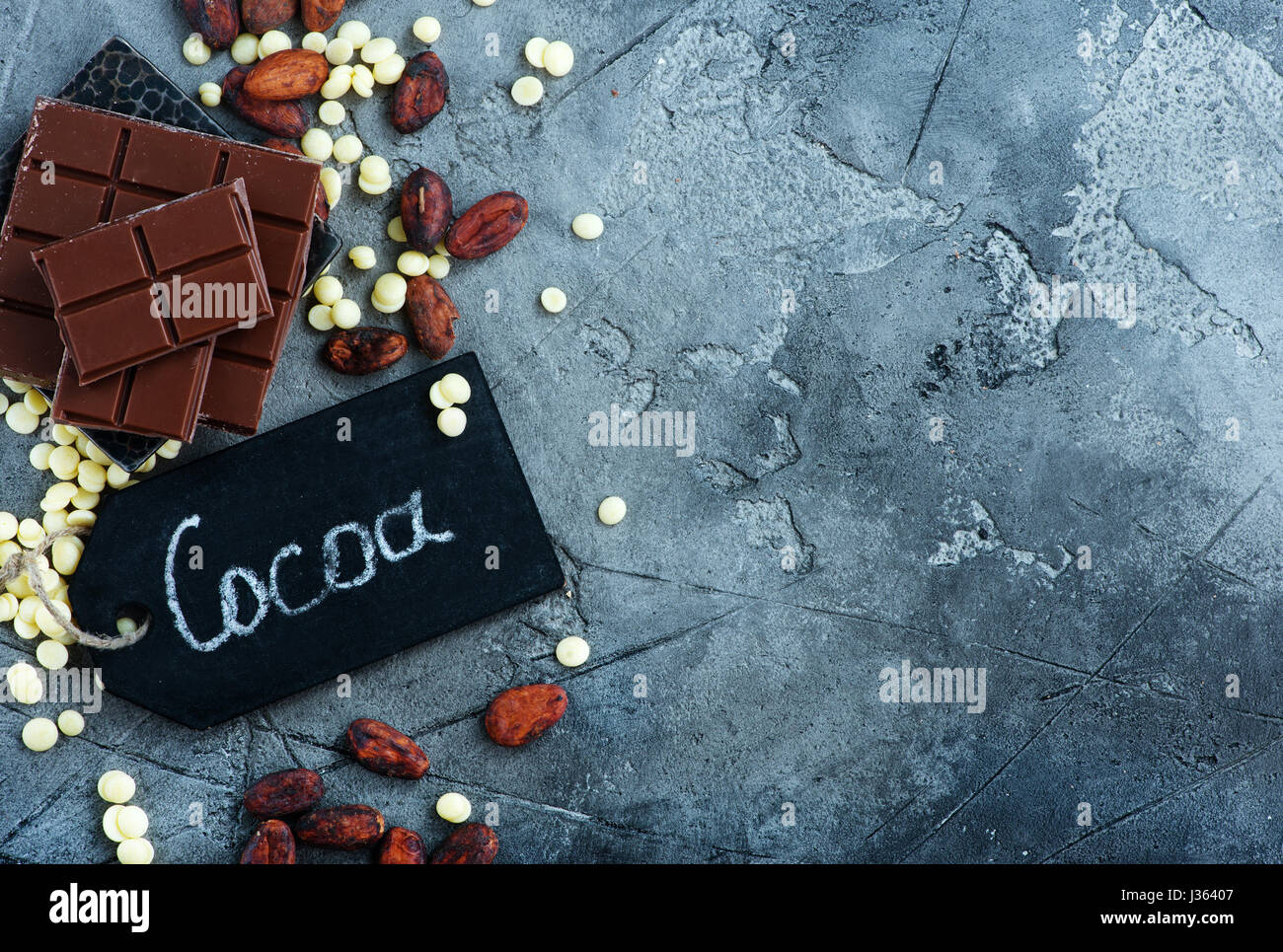 chocolate and cacao on metal plate and on a table Stock Photo - Alamy