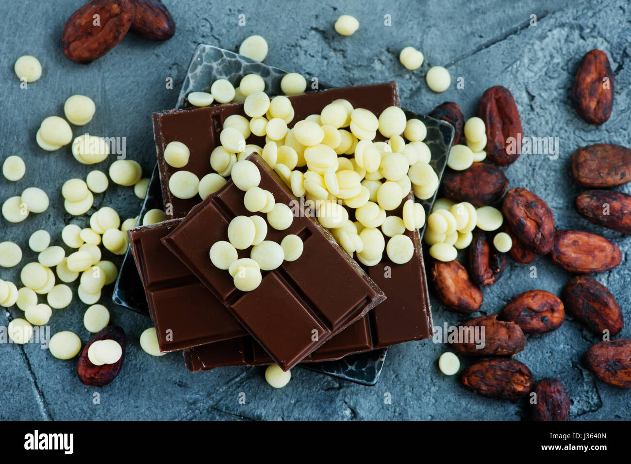 chocolate and cacao on metal plate and on a table Stock Photo - Alamy