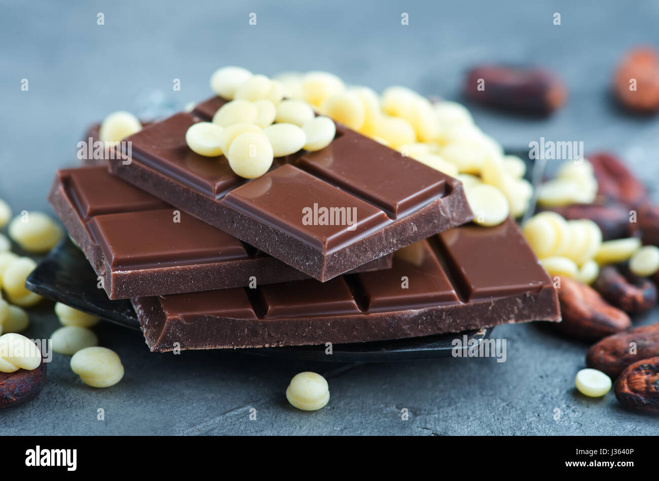chocolate and cacao on metal plate and on a table Stock Photo - Alamy