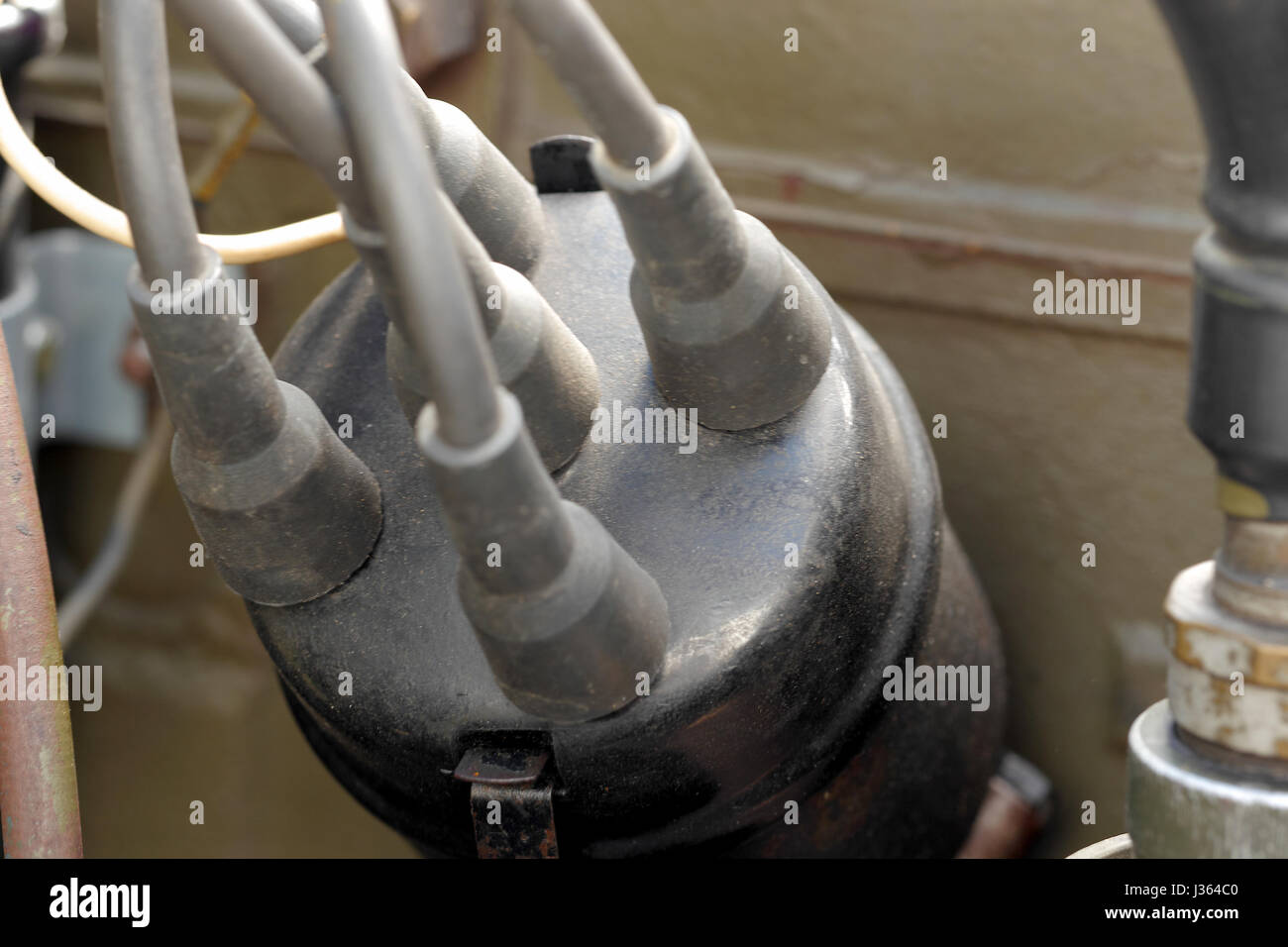 a distributor cap with silicone wires car parts Stock Photo - Alamy
