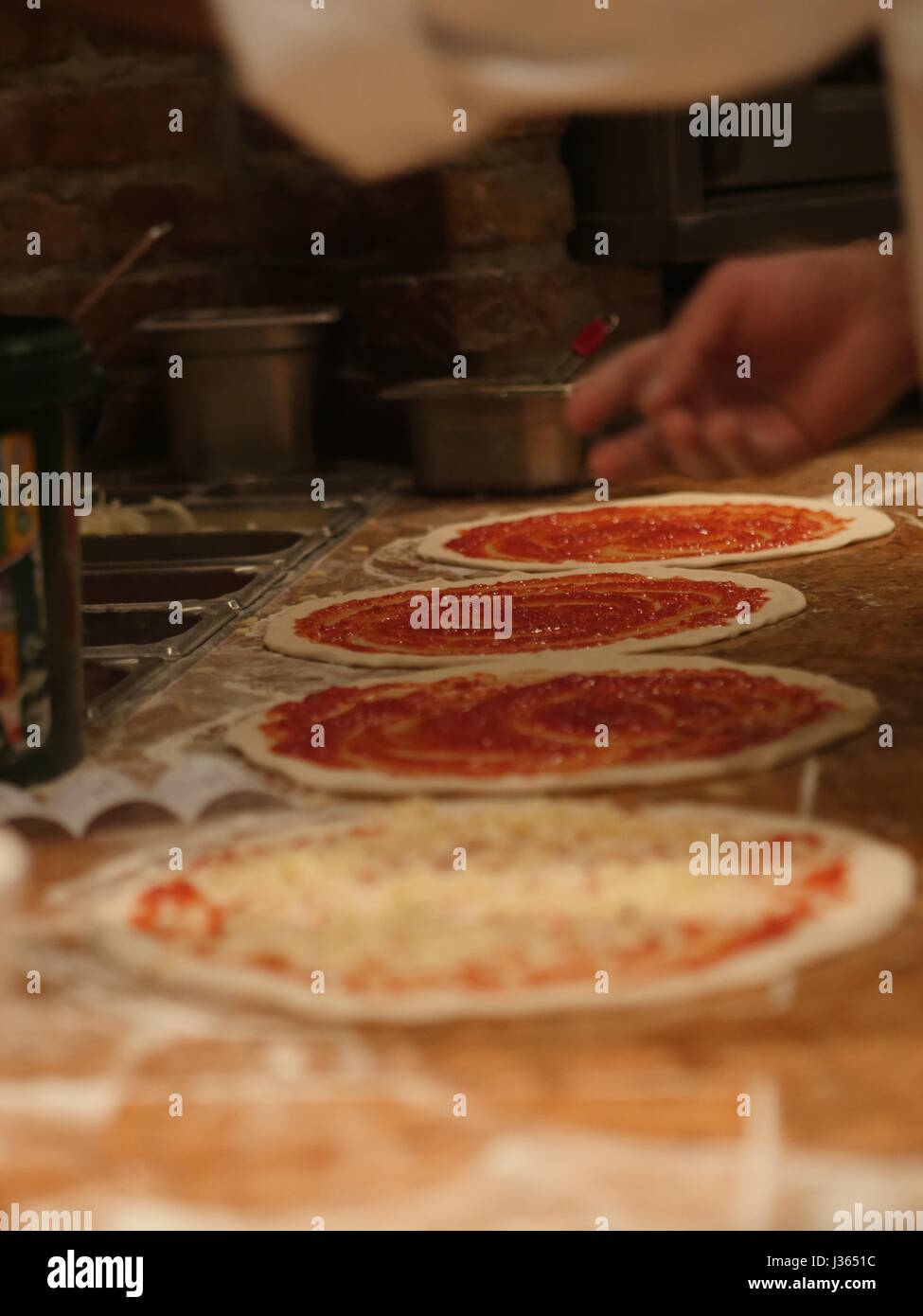 pizza preparation baking Stock Photo - Alamy