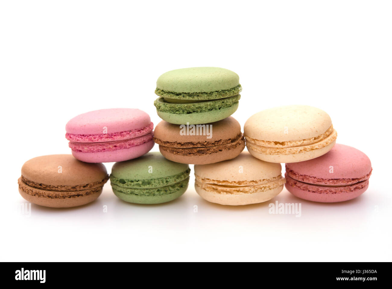 colorful macaroons line up on white background Stock Photo - Alamy