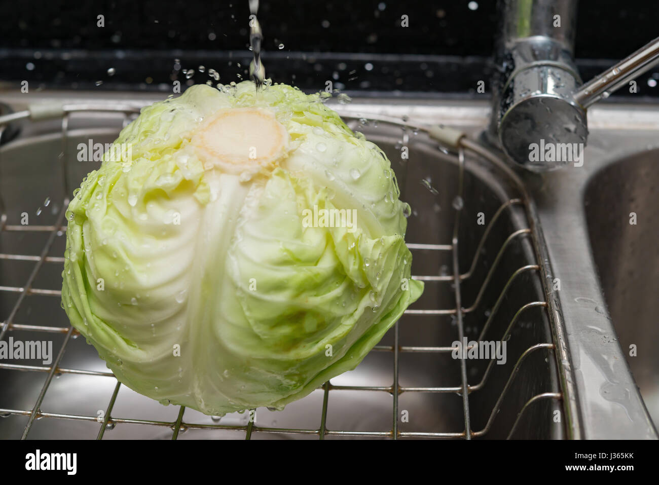 washing fresh cabbage on sink Stock Photo - Alamy