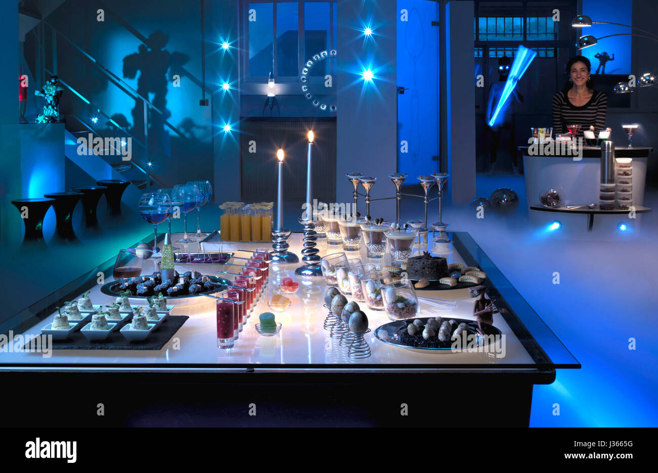 March, Totally Space theme dinner: Diane setting up the buffet Stock ...