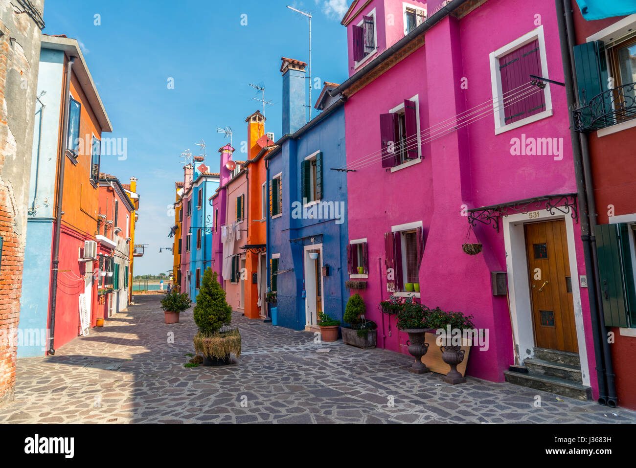 Burano, famous for its brightly colored homes, in the Venetian lagoon ...