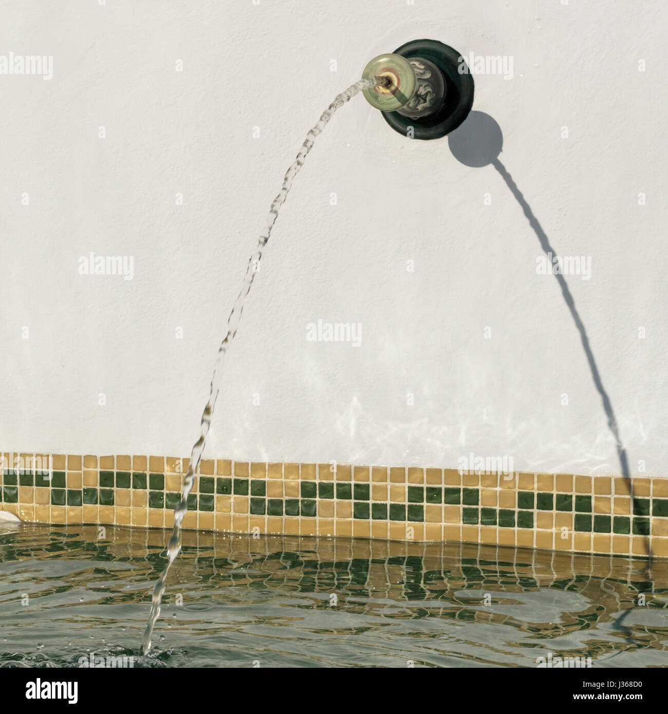 Water jet falling into a swimming pool Stock Photo - Alamy