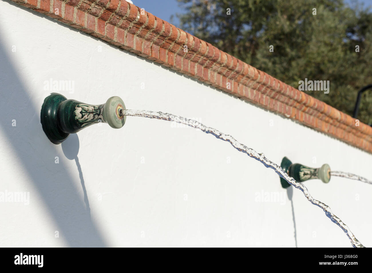Water jets falling into a swimming pool Stock Photo - Alamy