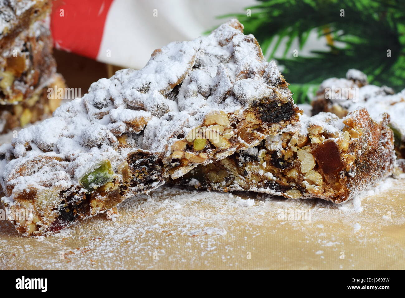 Italian Christmas dessert with nuts and candied fruits in a sugar ...