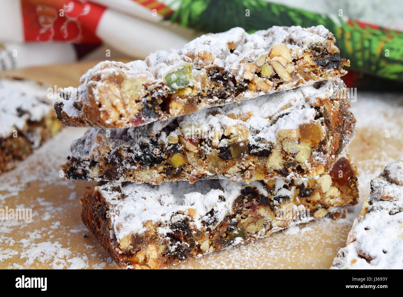 Italian Christmas dessert with nuts and candied fruits in a sugar ...