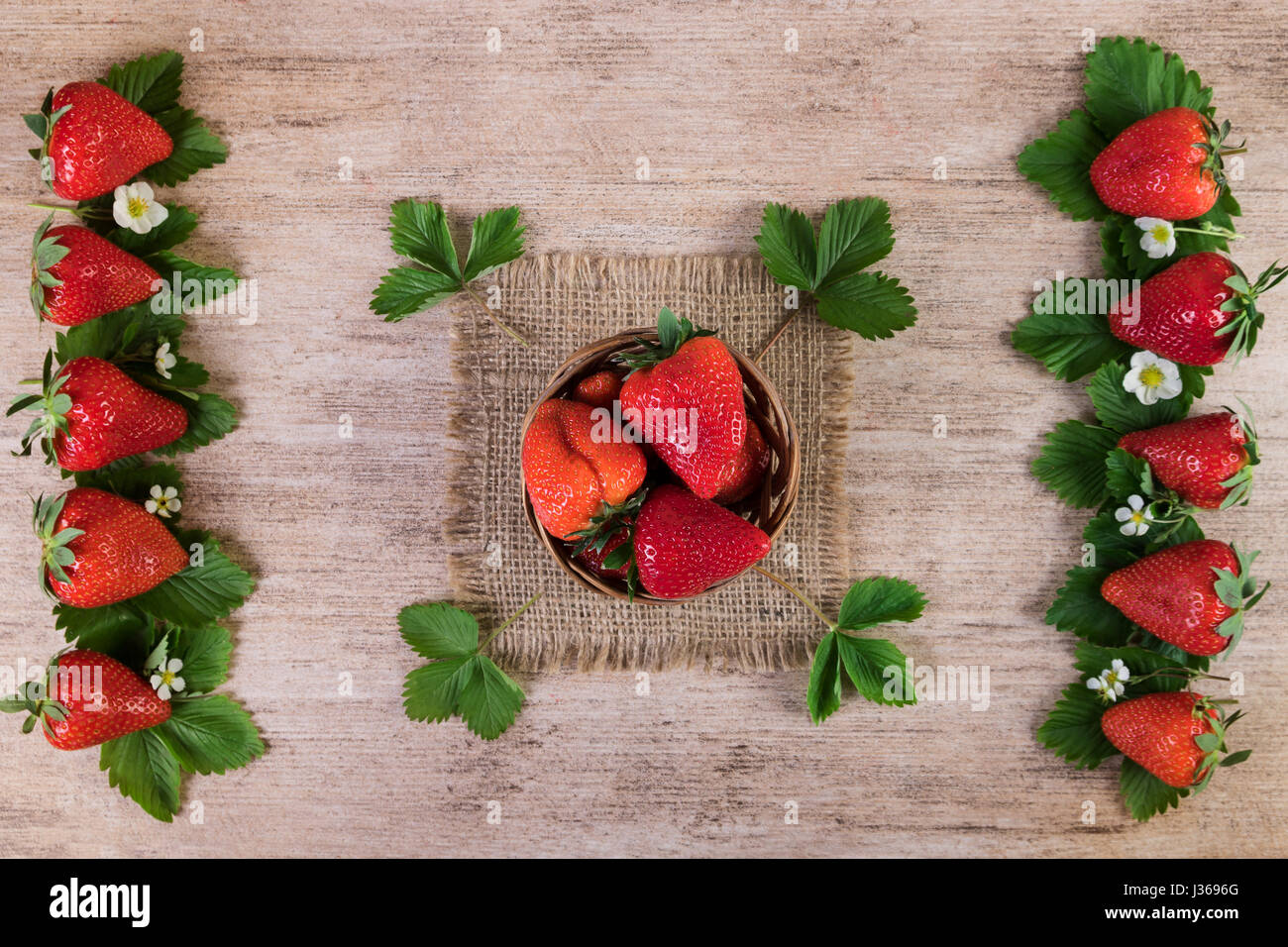 Ripe strawberries creative decorated on rustic background. Top view ...