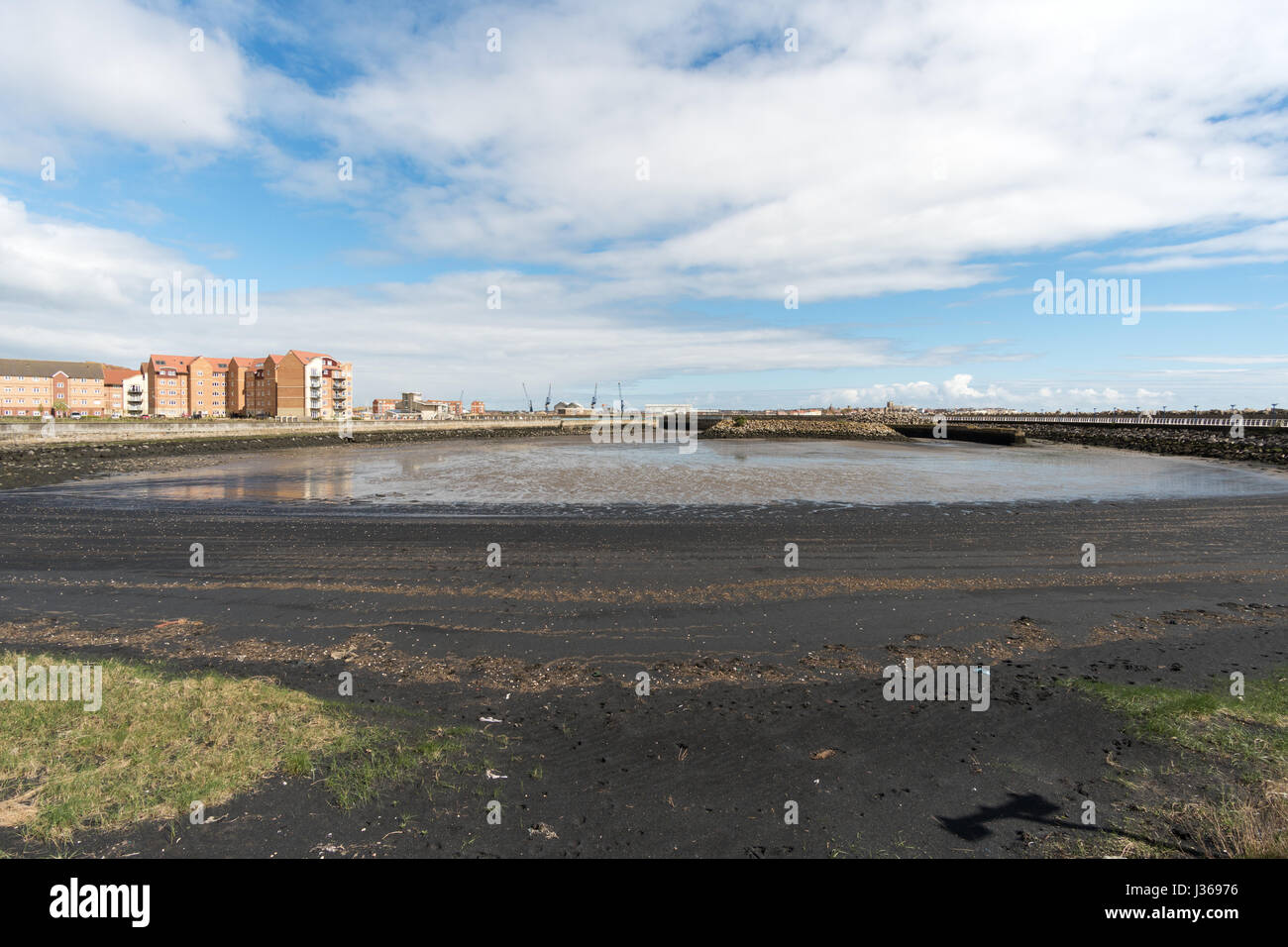 Sea coal in old Hartlepool west harbour between the south and middle ...