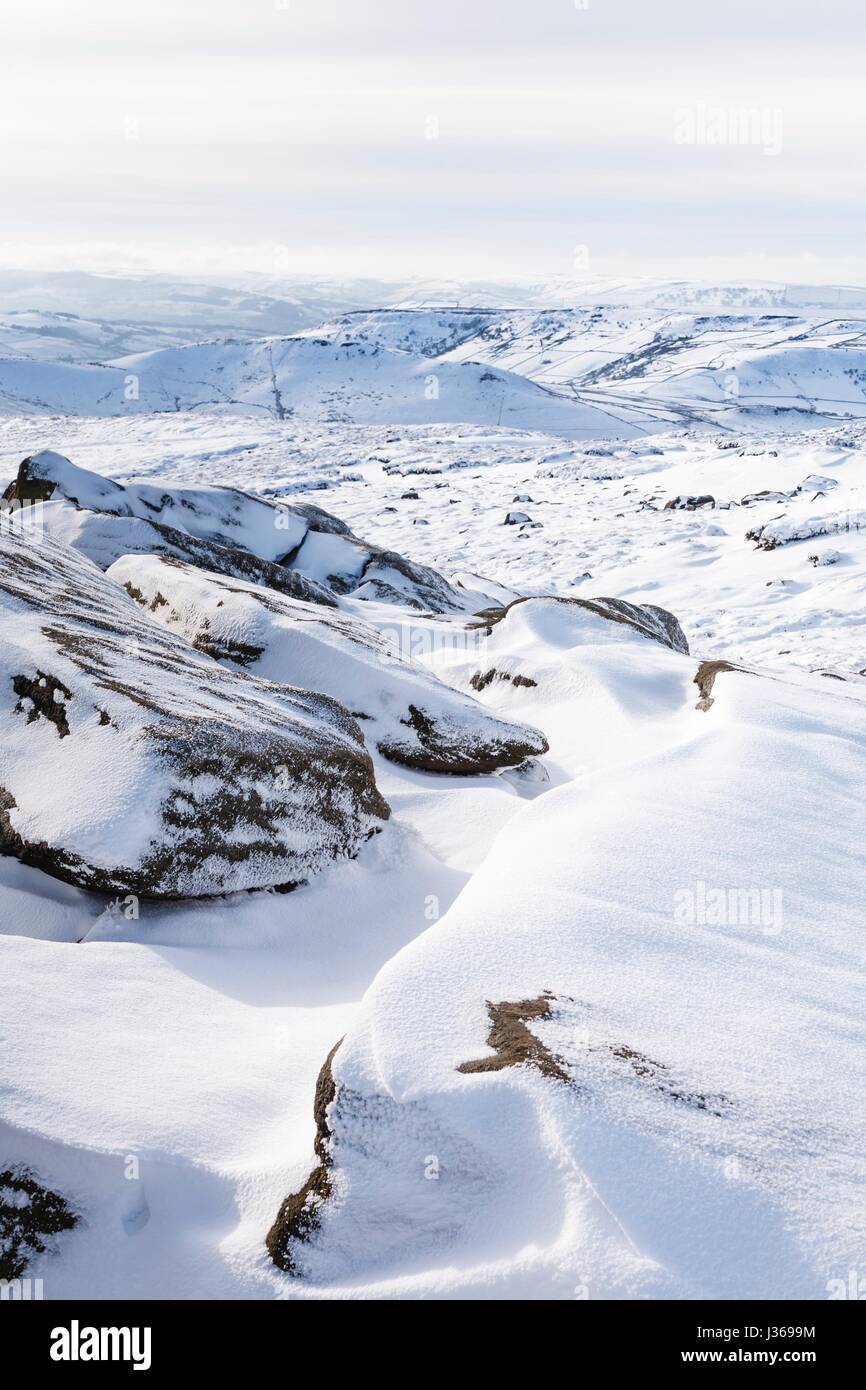 Snow covered tor landscape in winter, Kinder Scout, Derbyshire, England ...