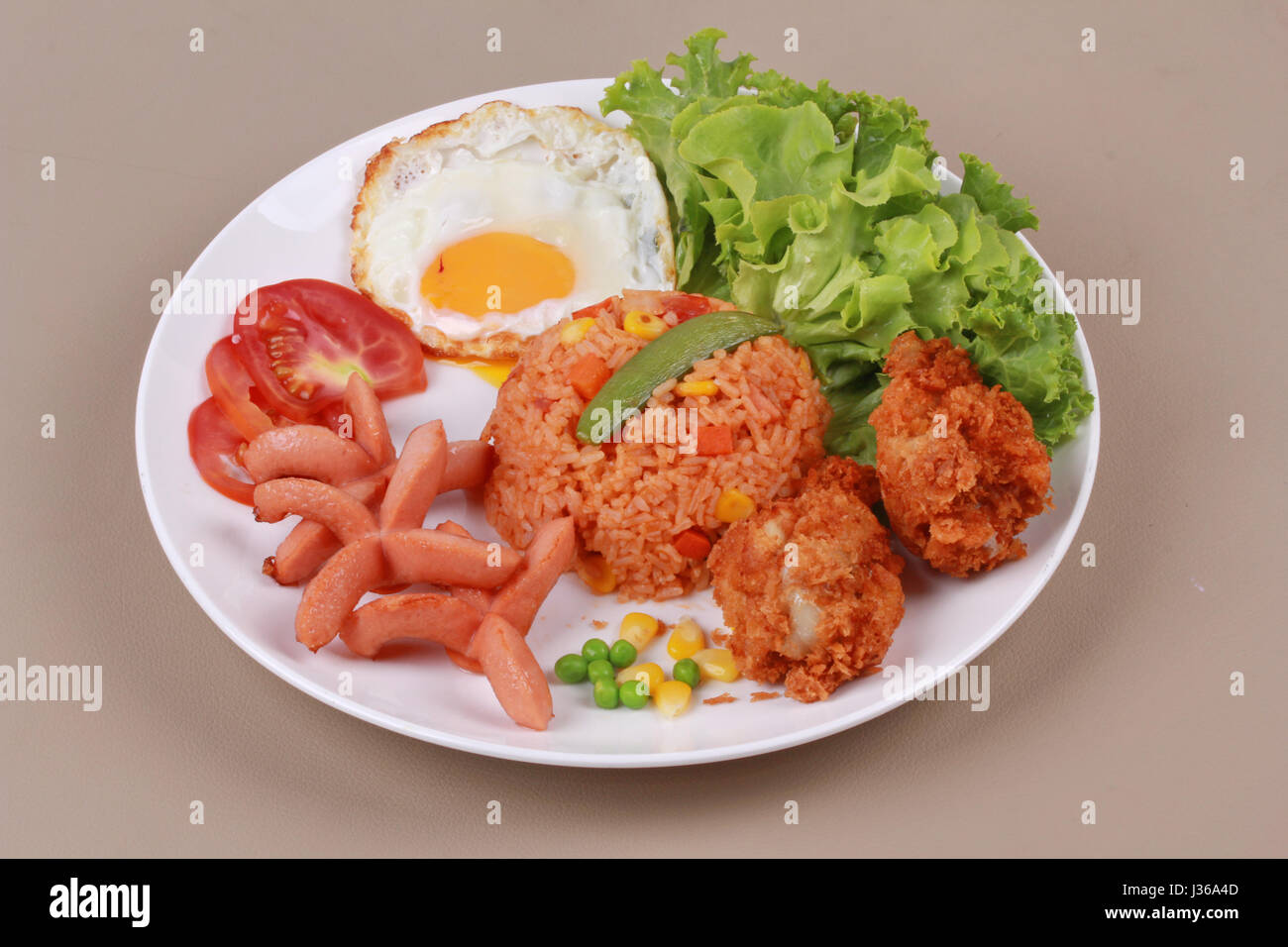 American style breakfast set, American fried rice topped sunny up egg ...