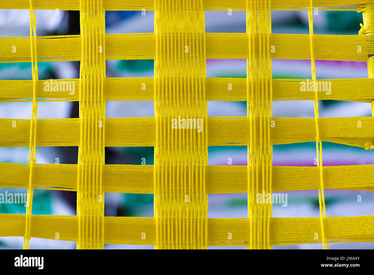 Yellow plastic rope weave Stock Photo - Alamy
