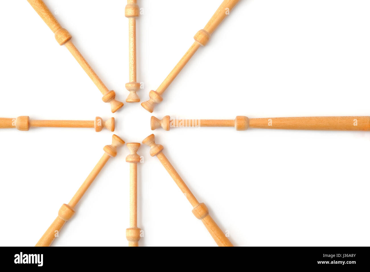 web of wooden lacemaking bobbin spindles on white Stock Photo - Alamy