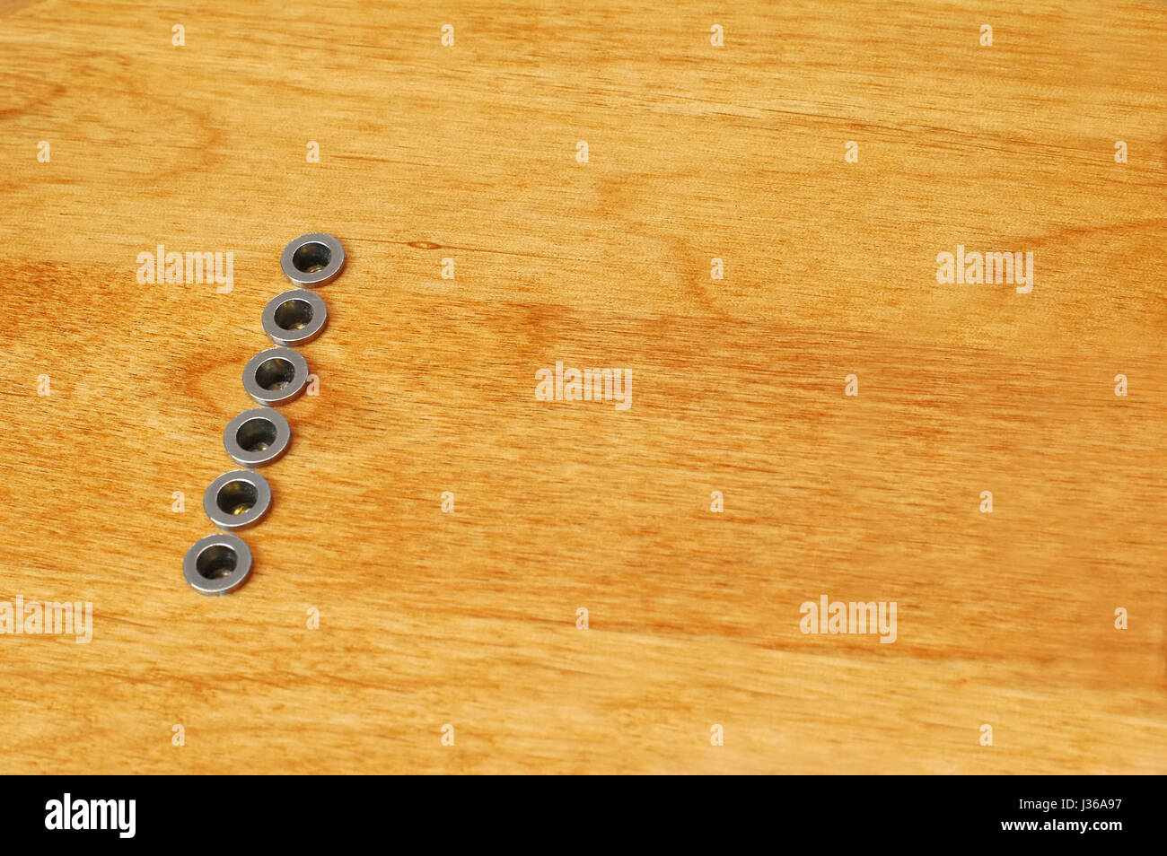 abstract of an electric guitar showing thread holes for strings through ...