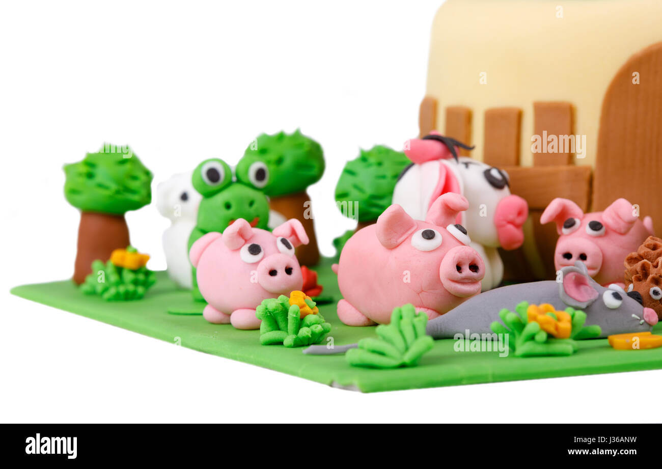 birthday cake with farm marzipan animals and number 3 isolated on white ...