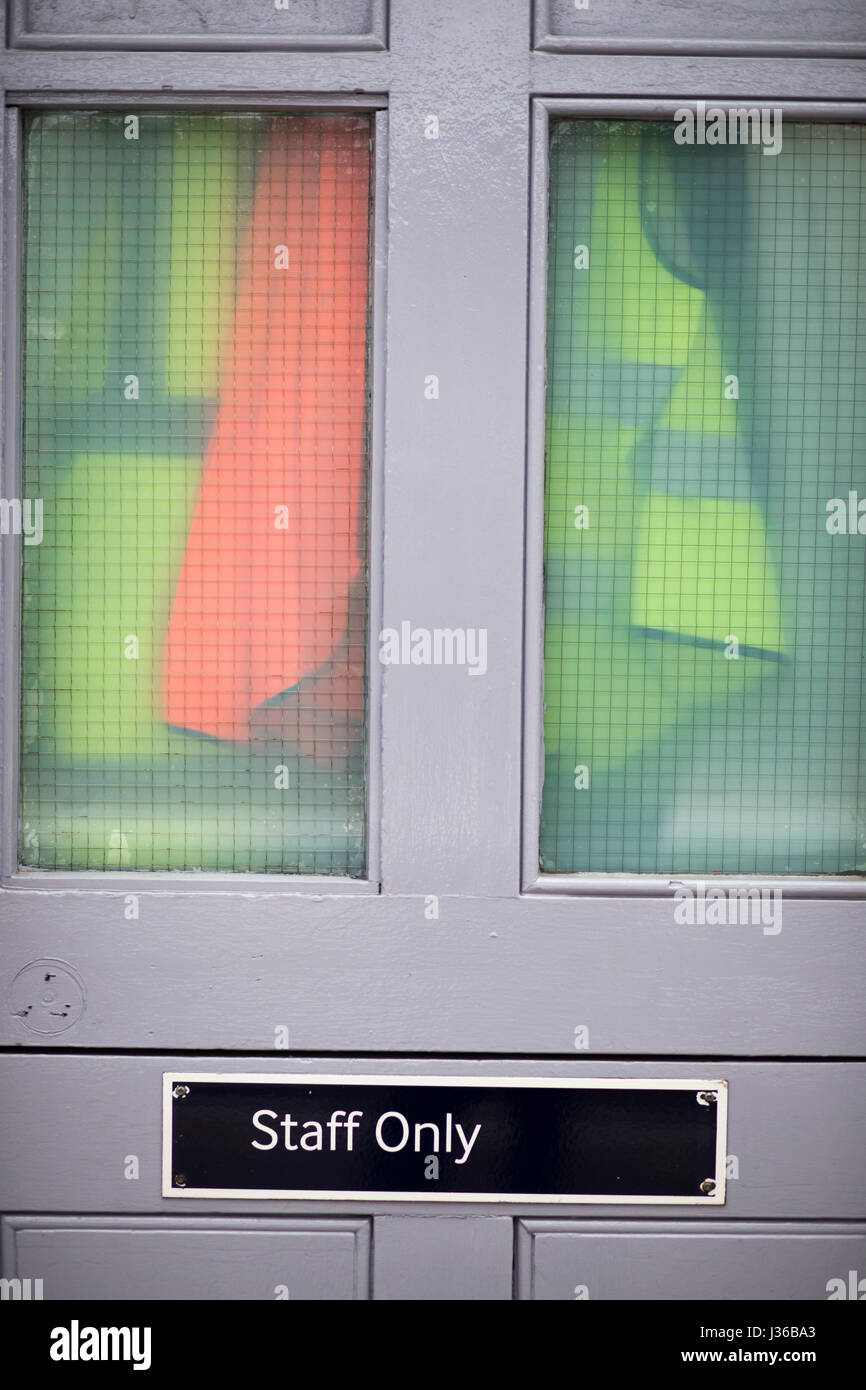 Staff only sign on Tonbridge Wells station door with hi visibility ...
