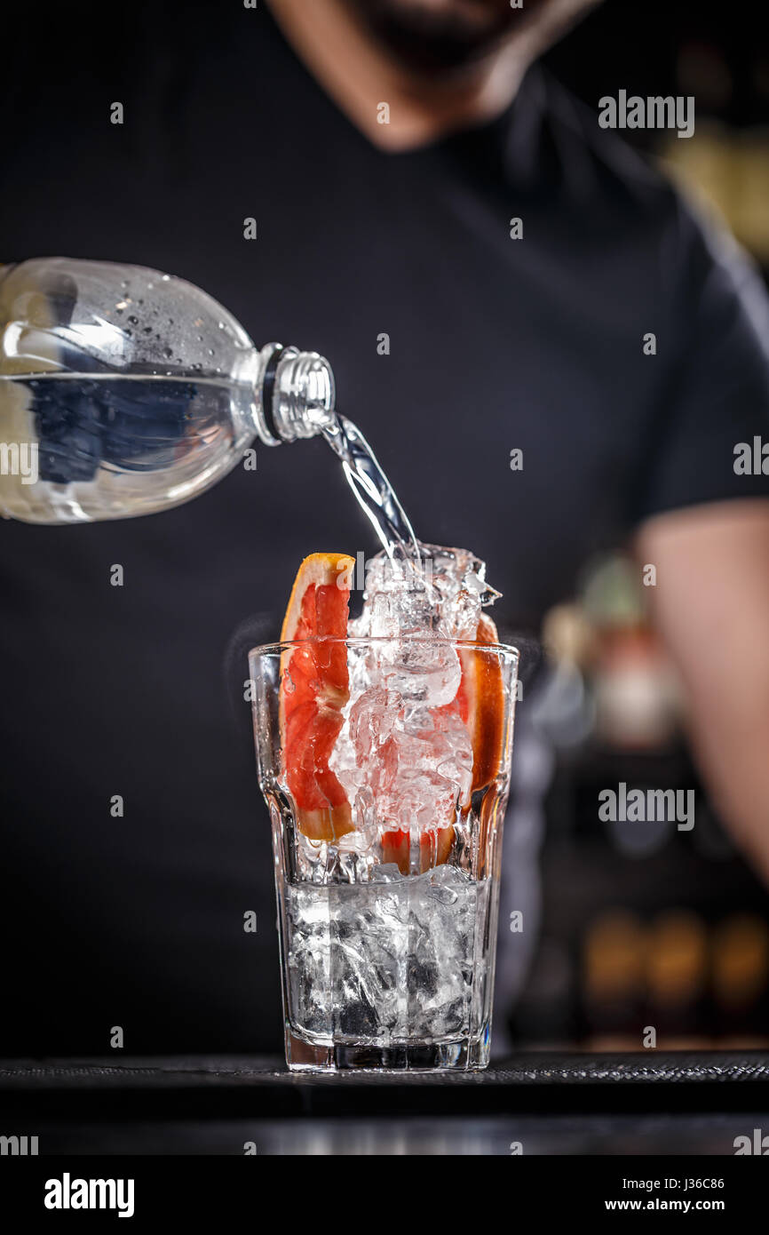 Barman at work, pouring spirit into a glass Stock Photo - Alamy