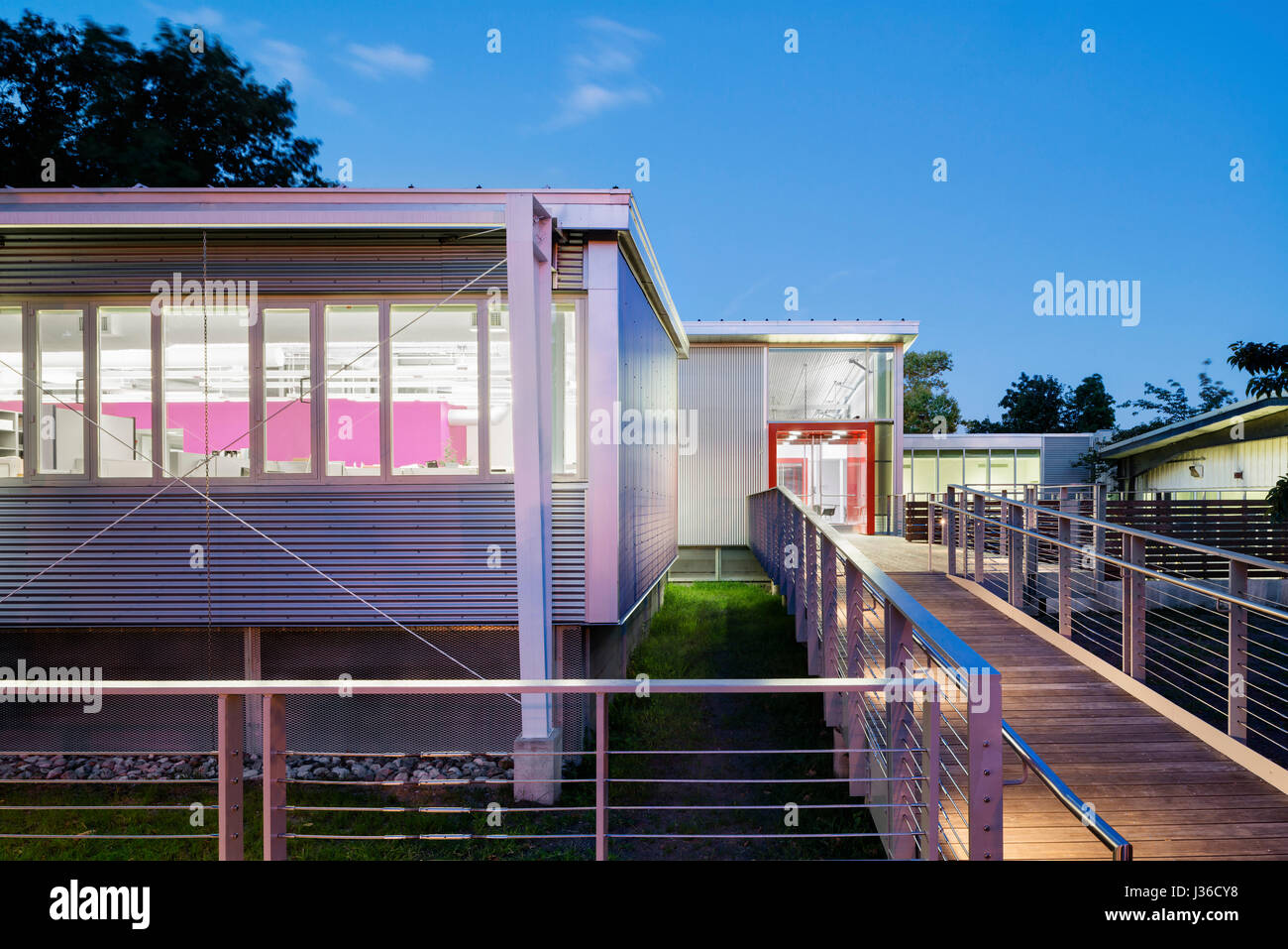 Exterior view with ramp leading to main entrance at dusk. Olmsted ...